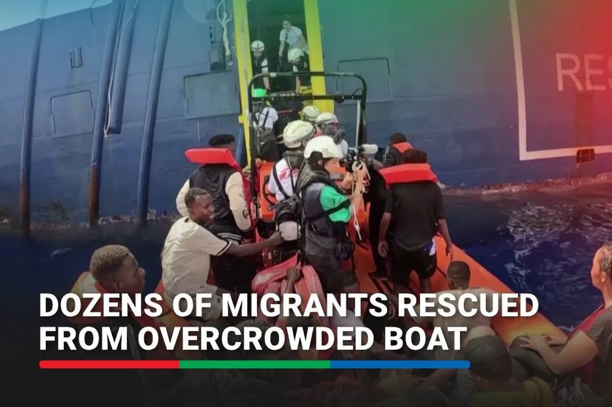 Dramatic video shows dozens of migrants rescued from overcrowded boat ...