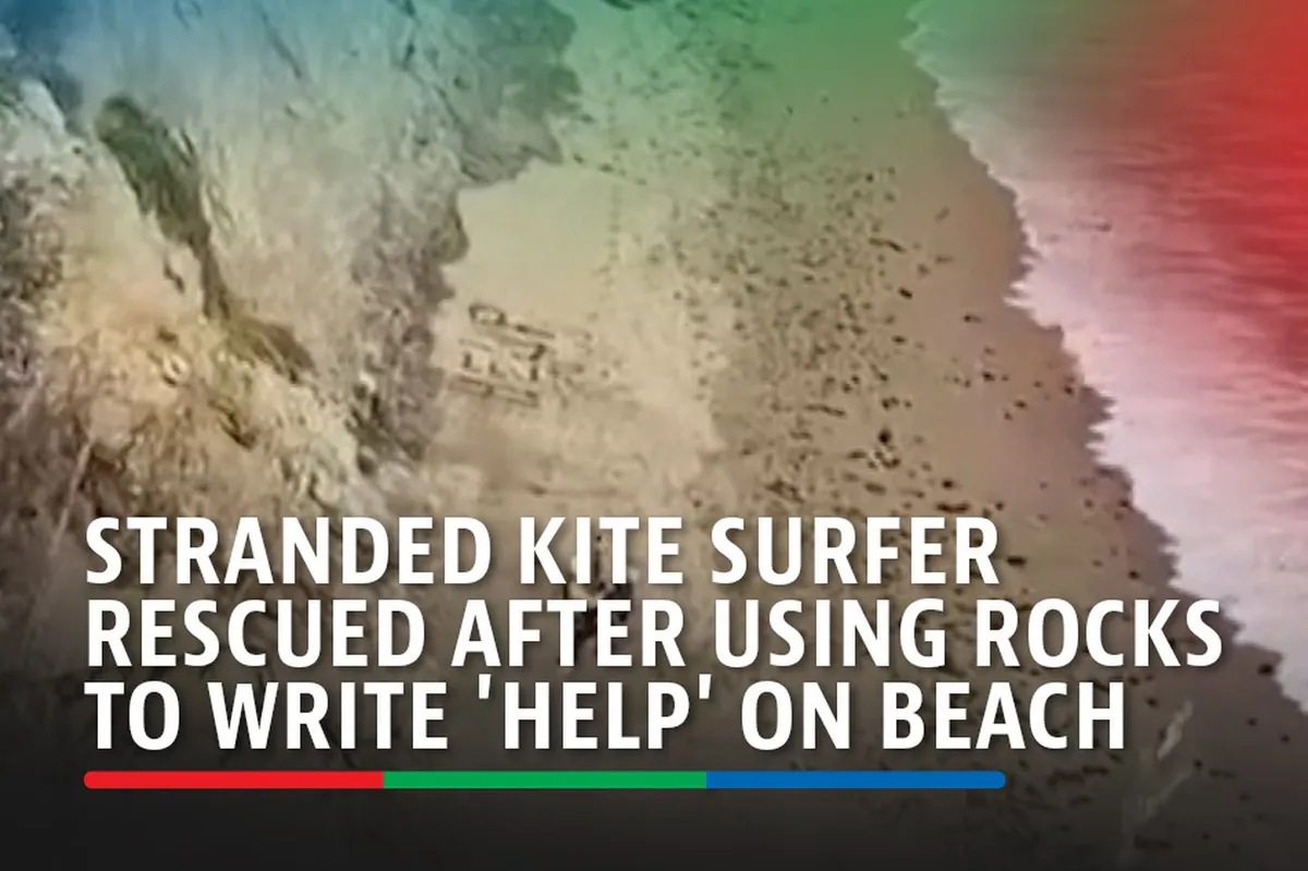 Stranded kite surfer rescued after using rocks to write 'HELP' on beach ...