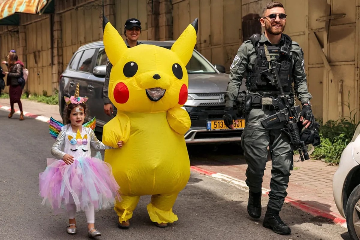Reveller dressed in Pikachu joins celebration of Jewish holiday | ABS ...