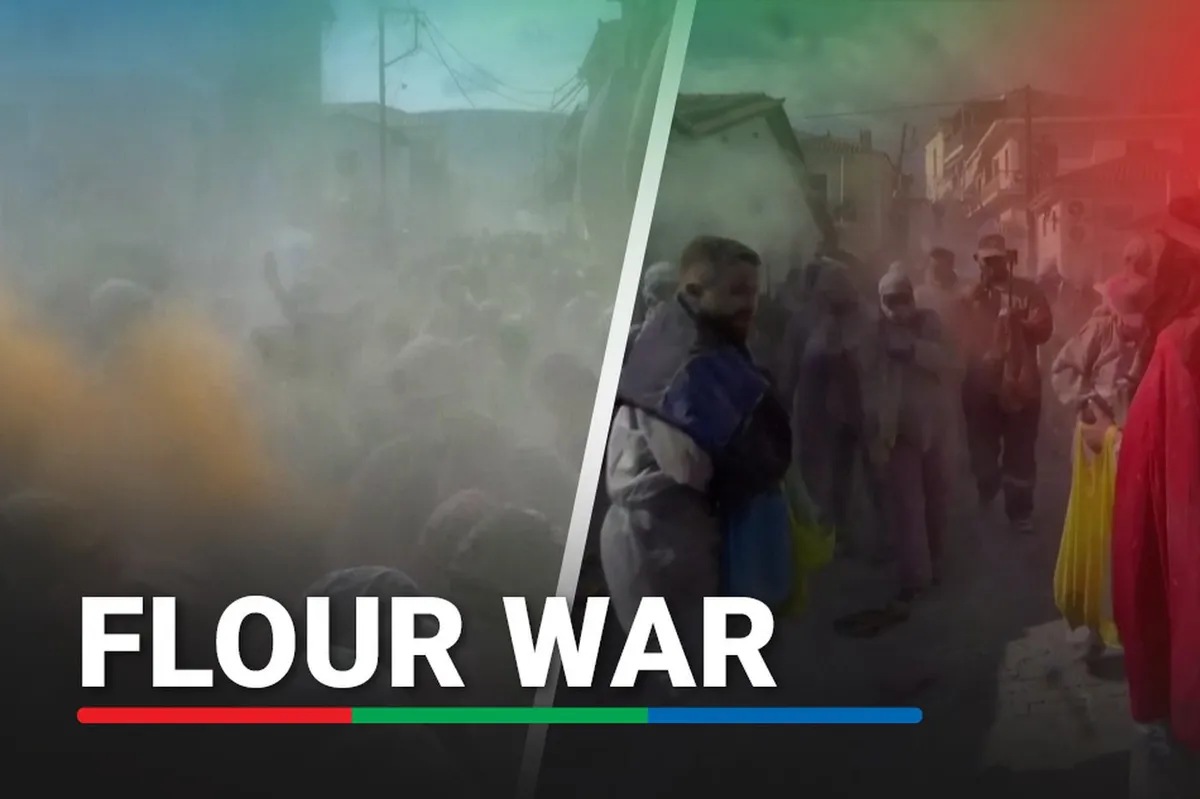 Revelers celebrate 'flour war' in Greek town | ABS-CBN News