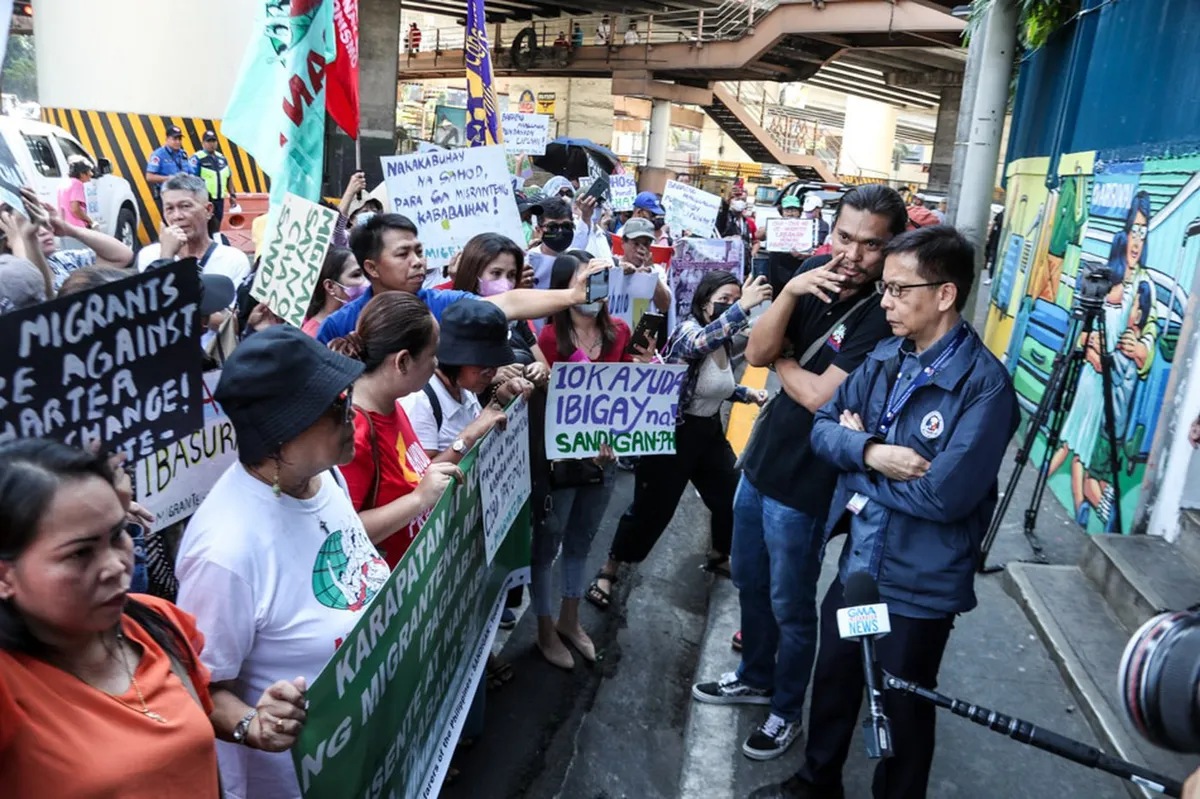 Filipino migrant workers push for better wages, benefits | ABS-CBN News