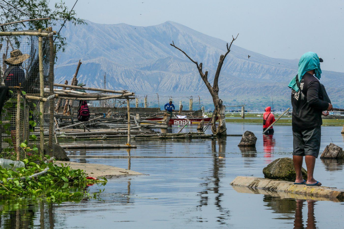 Health authorities distribute masks, vitamins to residents near Taal ...