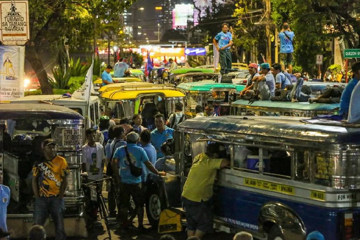 Protesting jeepney operators, drivers defy police orders to disperse ...