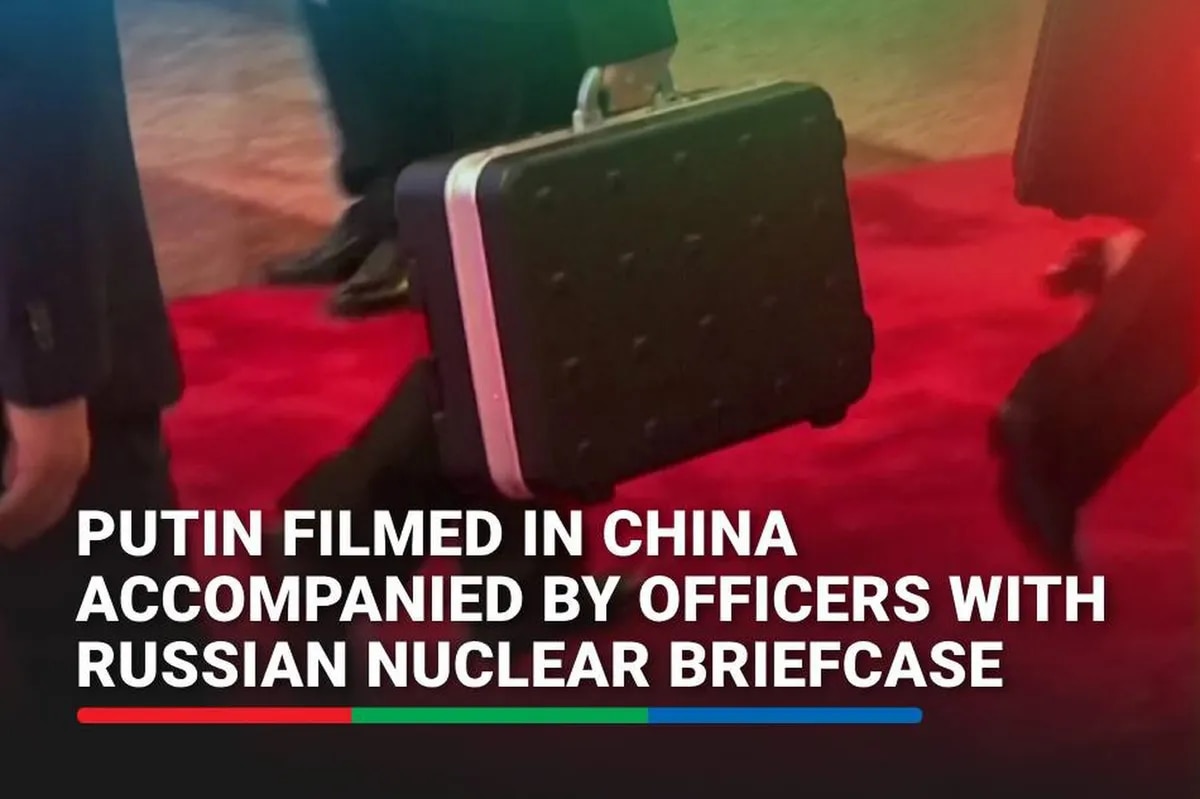 Putin filmed in China accompanied by officers with Russian nuclear ...