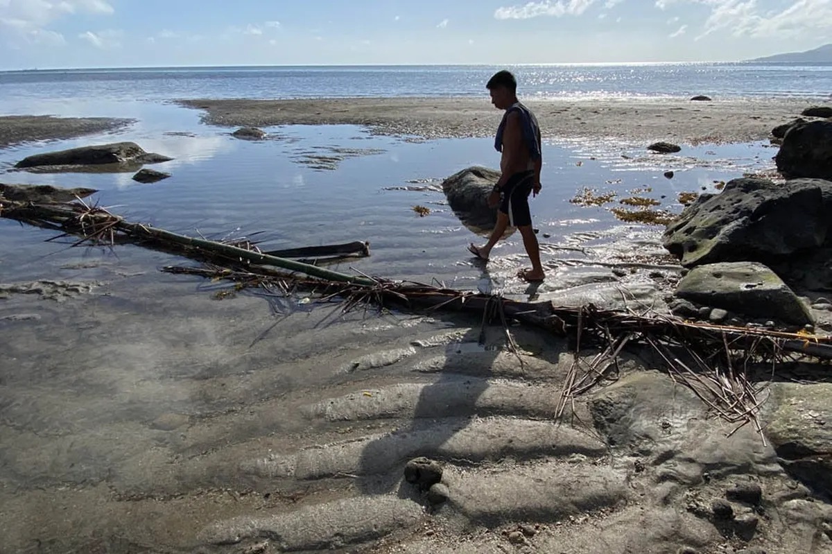 Fishing in Pola's blackened waters | ABS-CBN News