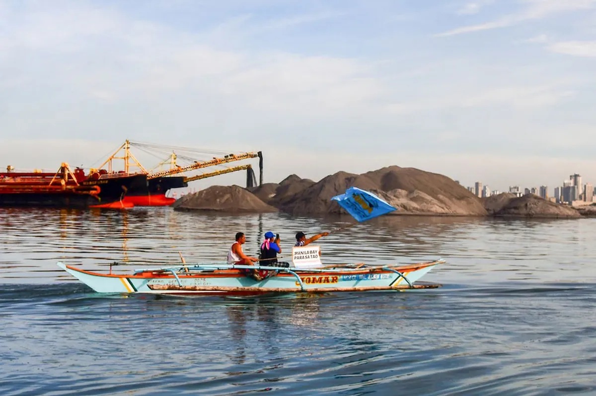 DOLE says to help workers in suspended Manila Bay reclamation | ABS-CBN News