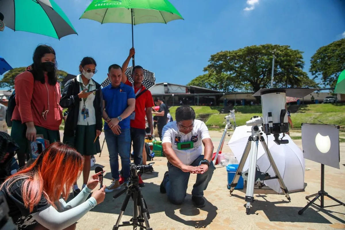 LOOK: Filipino sky watchers observe partial solar eclipse | ABS-CBN News