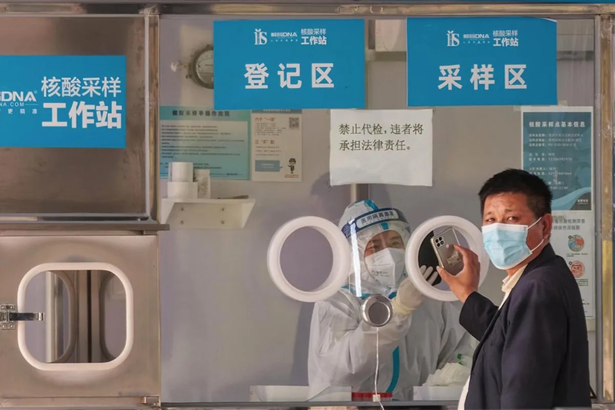 Chinese cities cancel mass COVID-19 tests in easing of measures | ABS-CBN