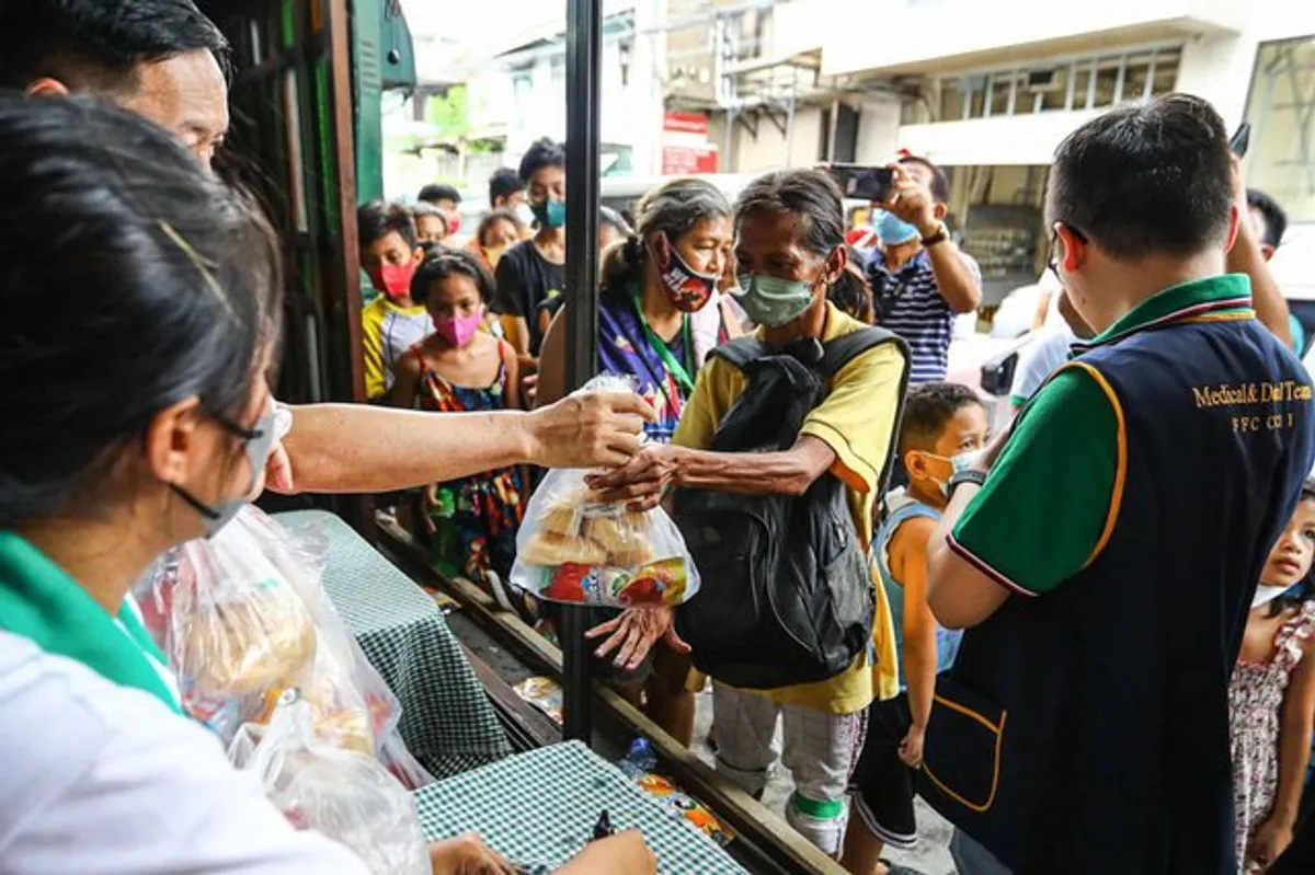 Lining up for free pandesal on World Food Day | ABS-CBN News