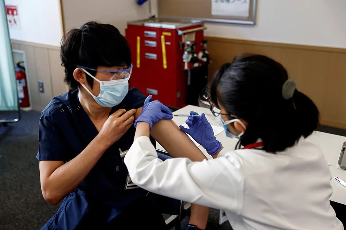 Japan Launches Covid 19 Vaccinations As Olympics Approach Abs Cbn