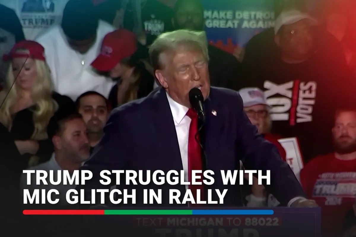 Trump battles microphone in Michigan as he courts voters in Detroit ...
