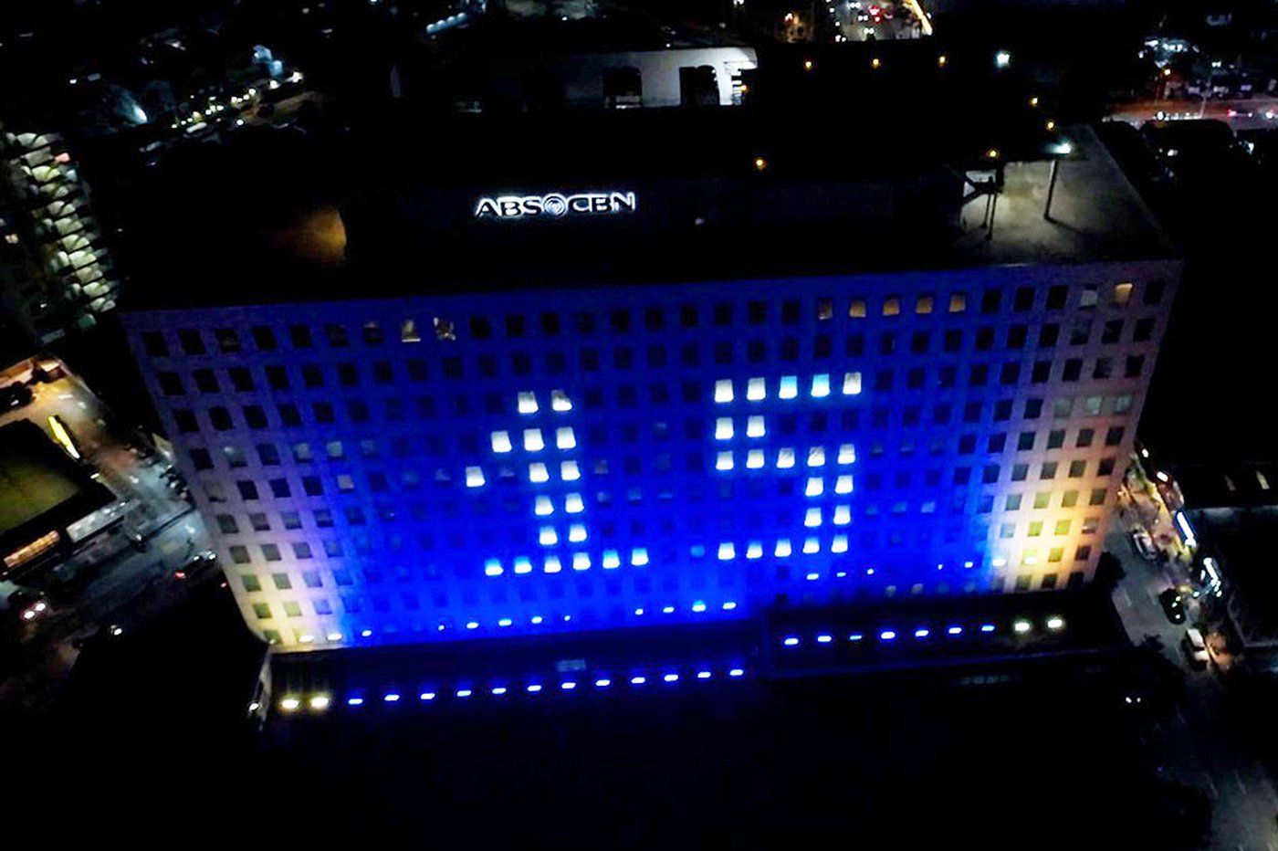 ABS-CBN's ELJ building lights up in blue and yellow to honor 'It's ...