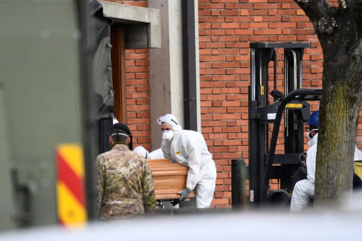 Italy's dead overwhelm morgues as COVID-19 toll tops 8,000 | ABS-CBN