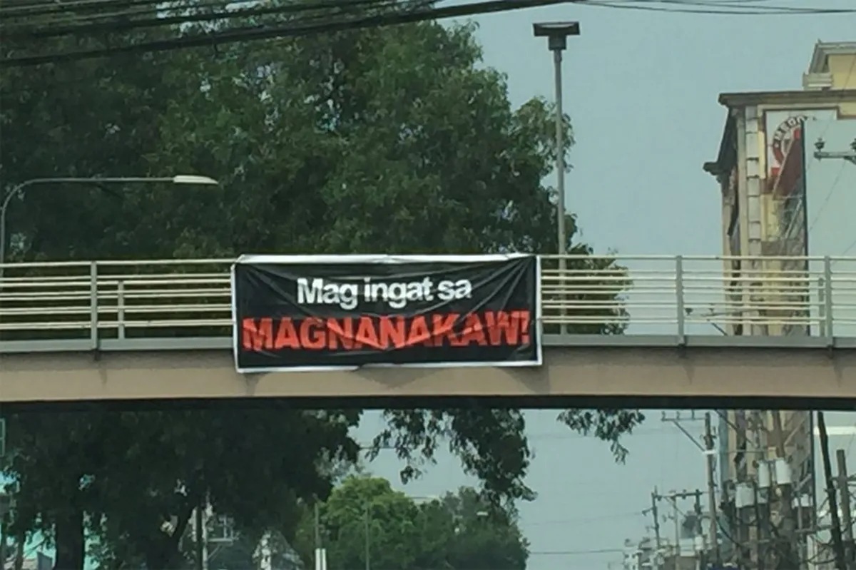 LOOK: QC tarp a warning vs 'thieves' ahead of 2019 polls? | ABS-CBN News