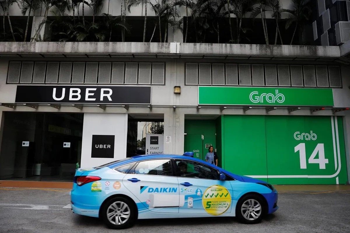Ride-hailing firm Grab hits back in Uber takeover row | ABS-CBN News