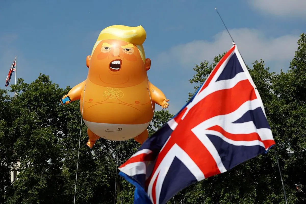Snarling orange 'Trump baby' blimp flies outside British parliament ...