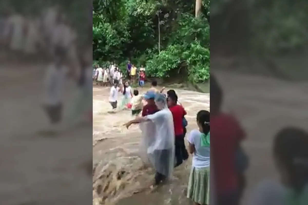 WATCH: Students in Iligan cross raging river | ABS-CBN News
