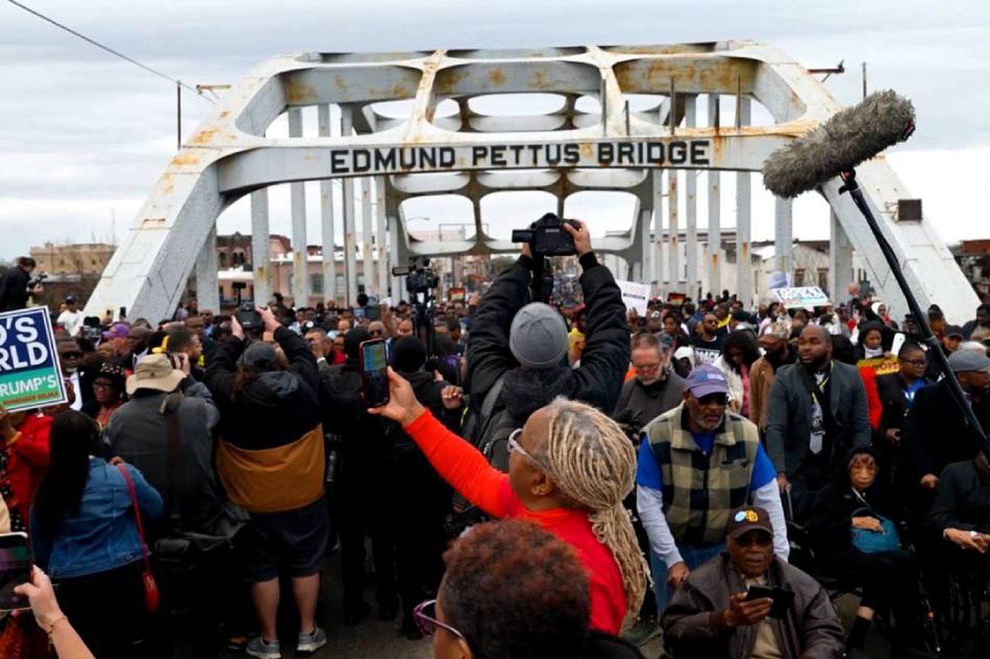 Hundreds march across Edmund Pettus Bridge to mark 60th anniversary of ...