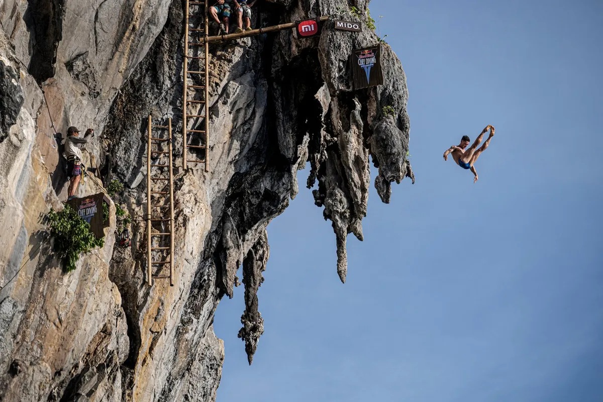 Romania's Popovici, USA's Arnett lead way after Day 1 of El Nido cliff ...