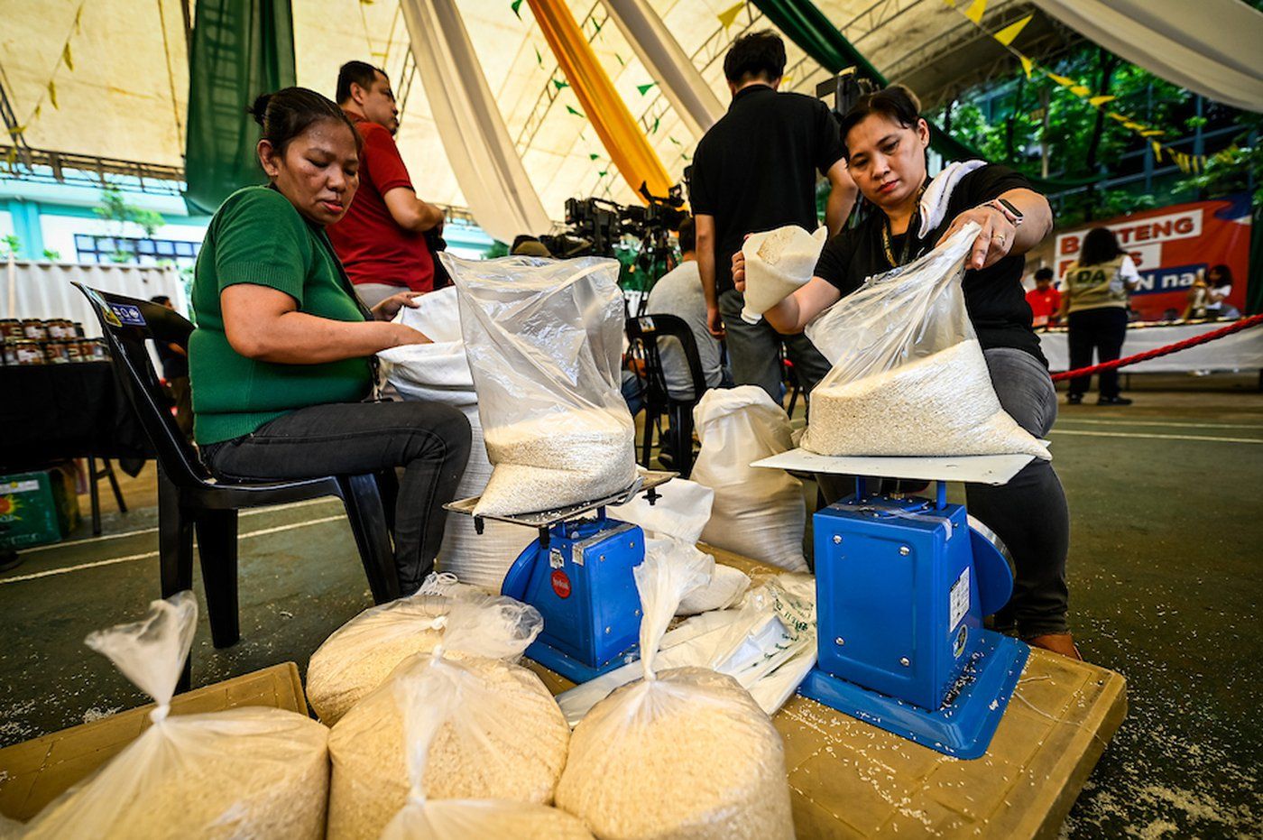 Gov't may shoulder full cost of cheap rice program by 2026: Marcos ...