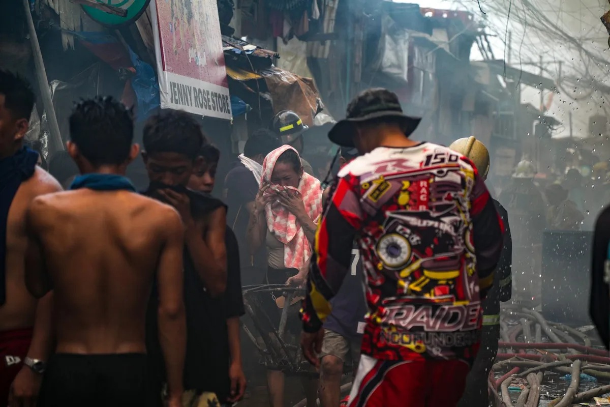 873 families affected by Tondo fire receive P15,000 each from DSWD ...