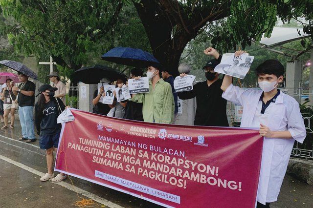 Bulacan protesters brave rain in rally vs. anomalous flood control ...