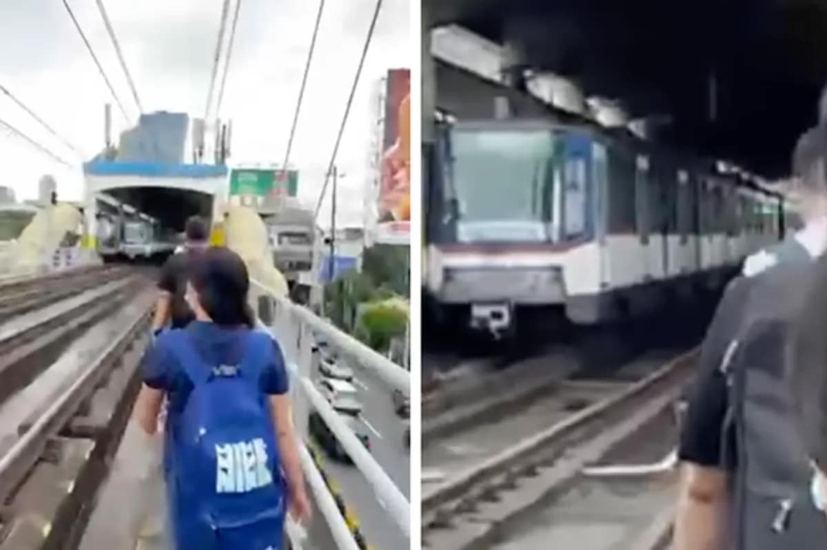 Technical issue halts MRT-3, passengers walk along tracks | ABS-CBN News