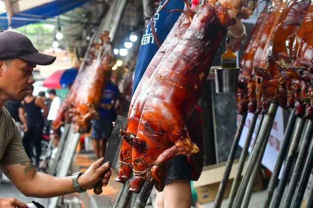 Customers now back in La Loma to buy lechons for Christmas parties ...