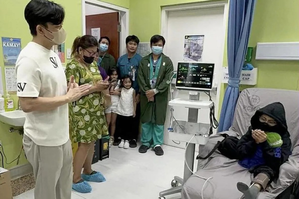 Sam Versoza leads gift-giving activity for children undergoing medical ...