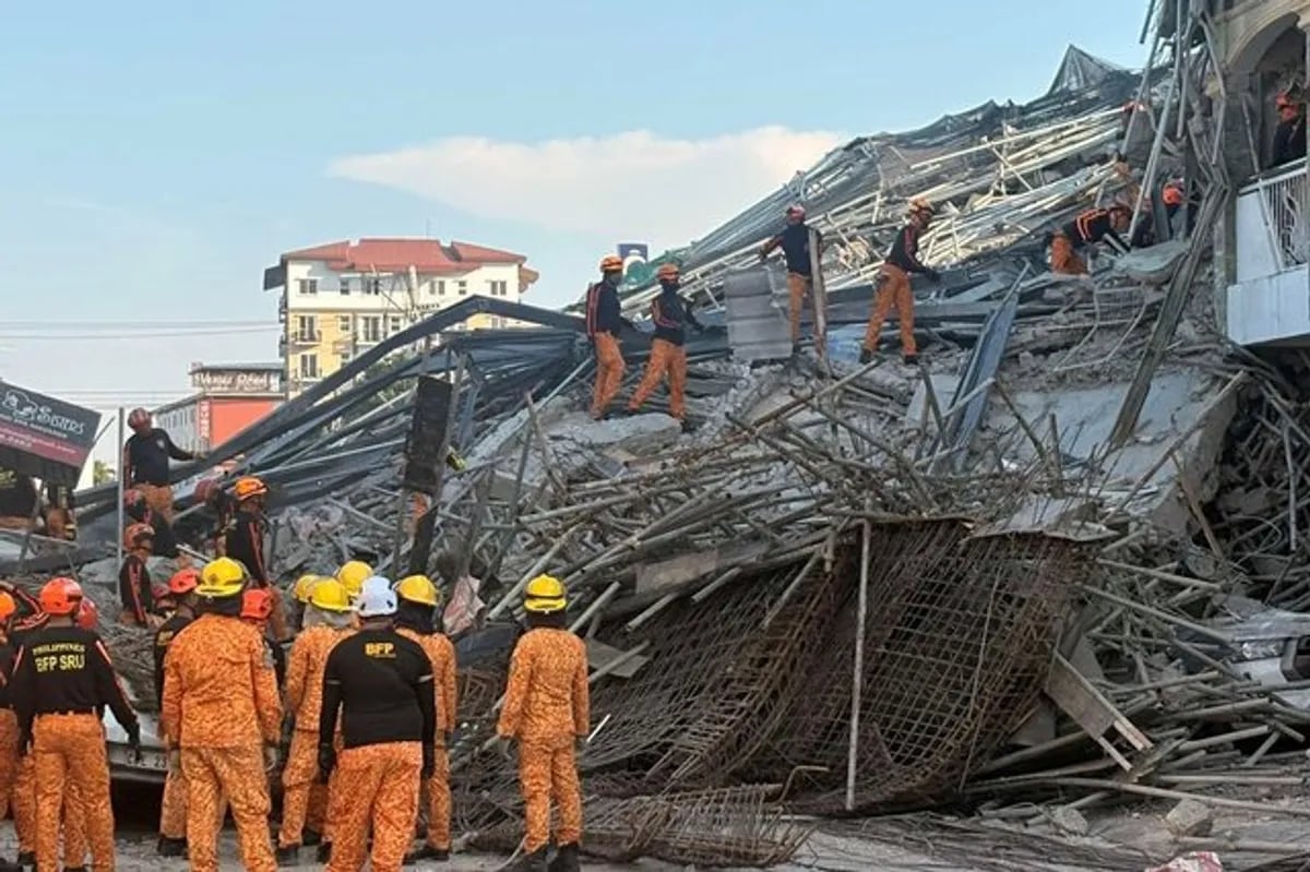 Signs of life detected, rescuers race to save workers in collapsed ...
